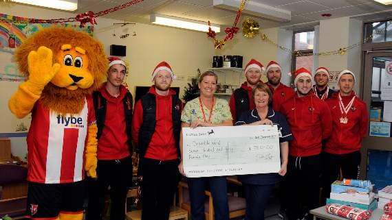 Exeter City stars deliver gifts and Christmas cheer to Bramble ward’s ...