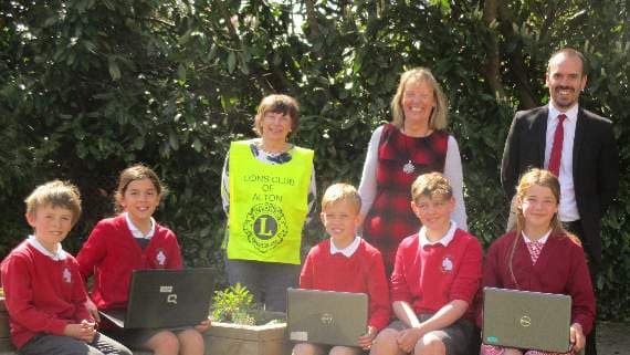 Binsted pupils get laptops from Lions | farnhamherald.com