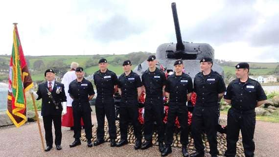 People brave the weather to remember lives lost in Exercise Tiger on ...