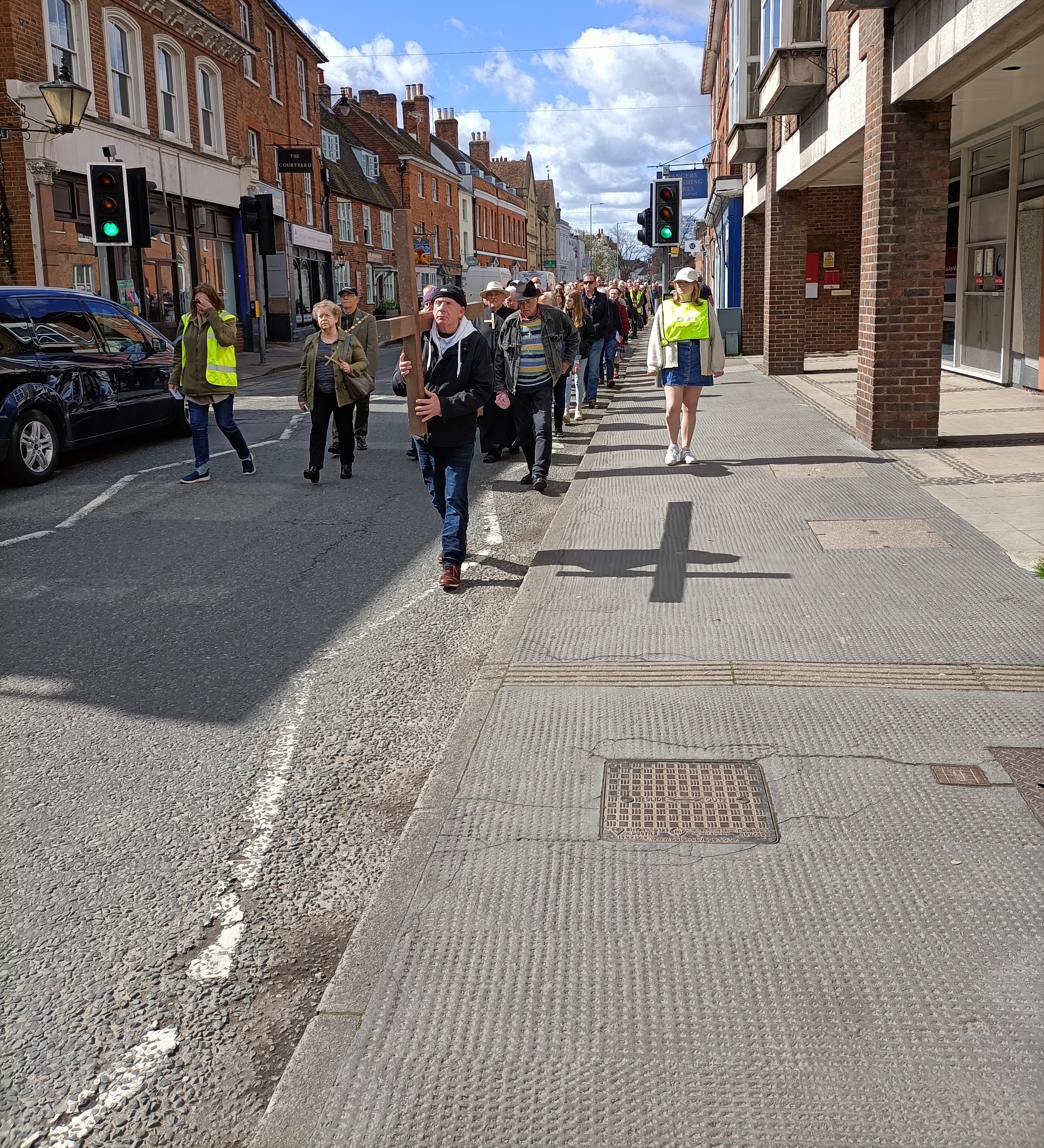 Walk of Witness: Christians carry the cross through the streets of ...