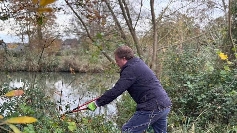 MP swaps politics for pond life at Badshot Lea community clean-up ...