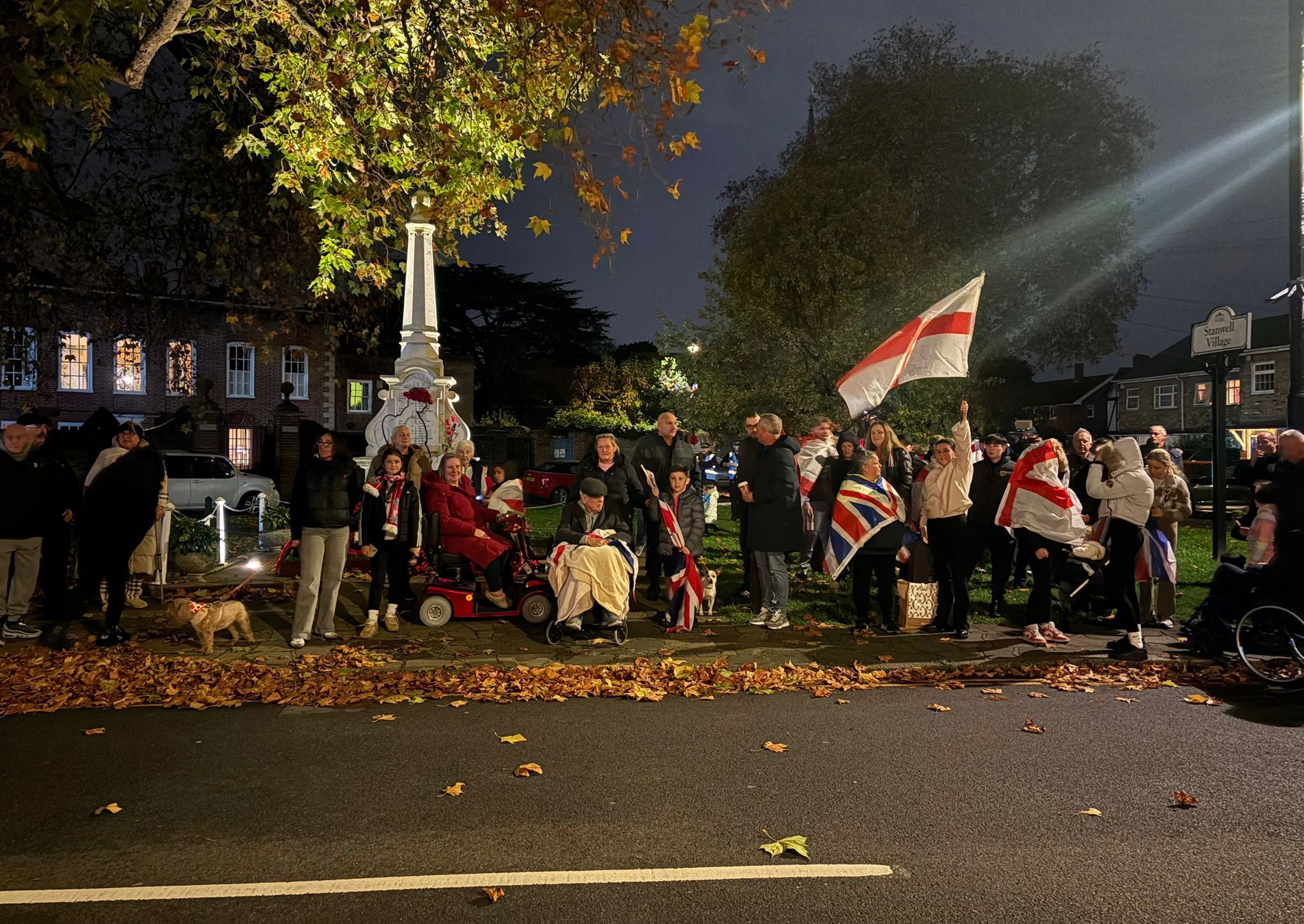 Surrey residents mark 100 days of protest outside asylum seeker hotel ...