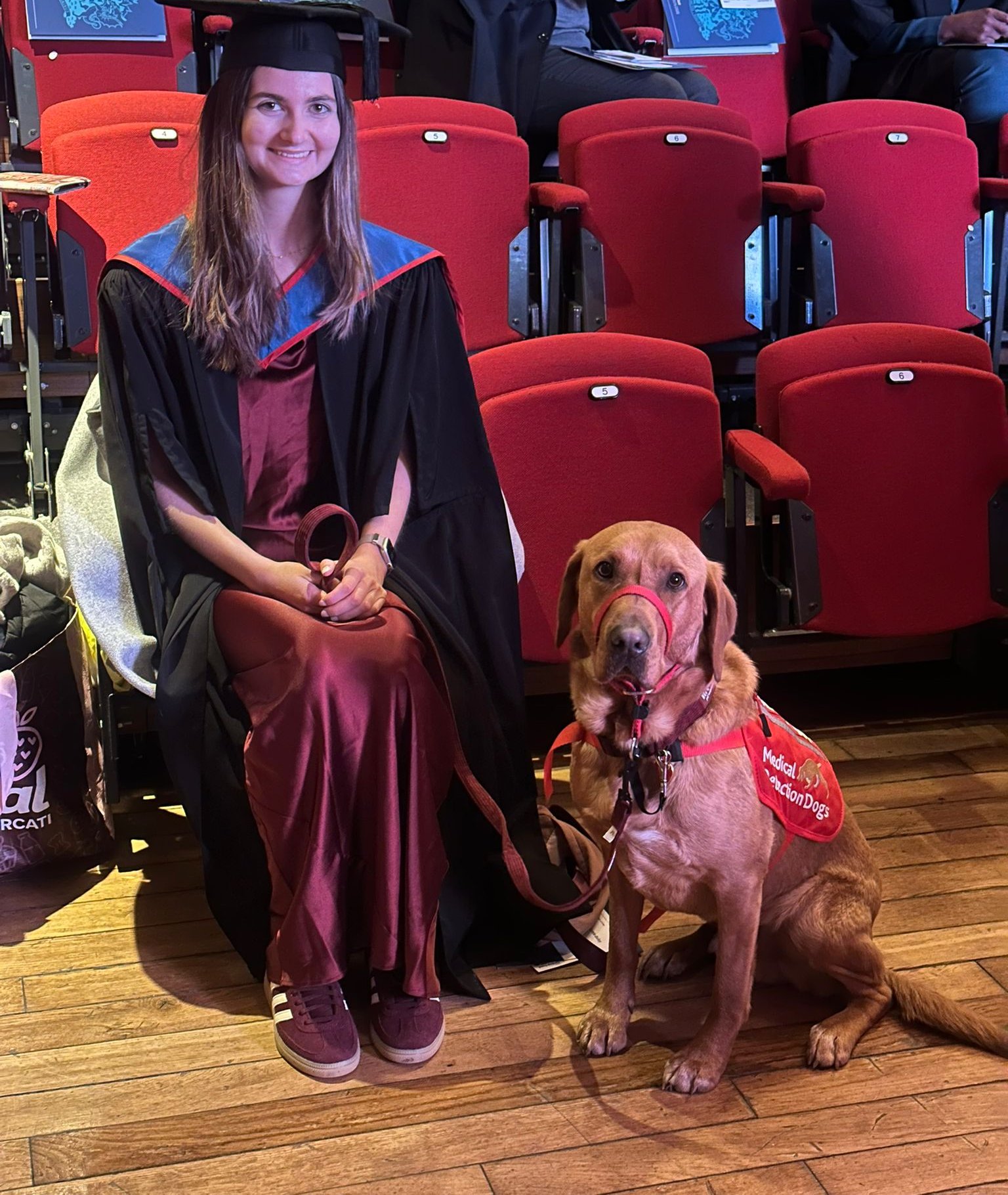 WATCH: Medical alert dog helps woman achieve law career dream ...